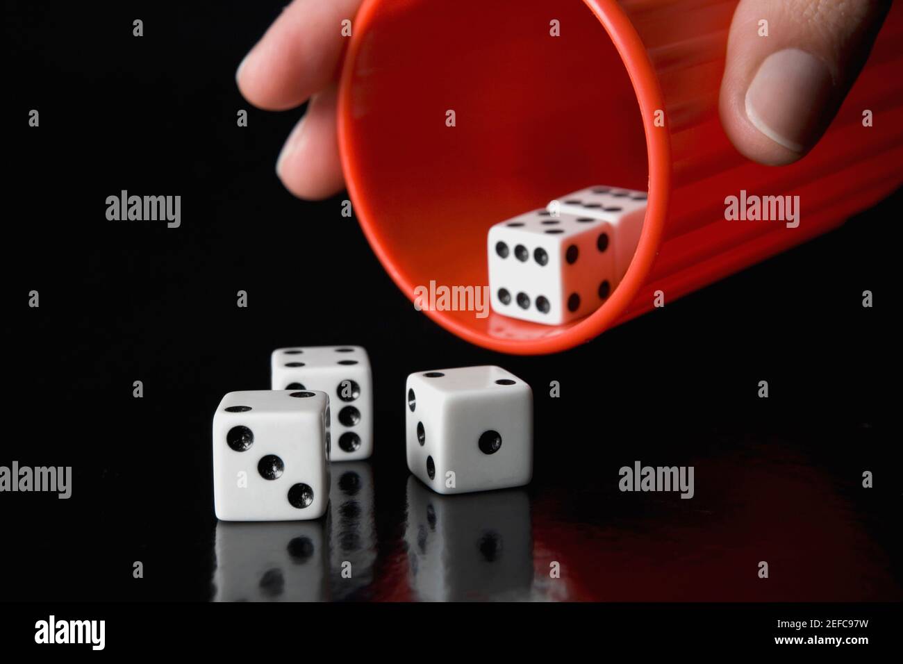 Hand throwing dice hi-res stock photography and images - Alamy
