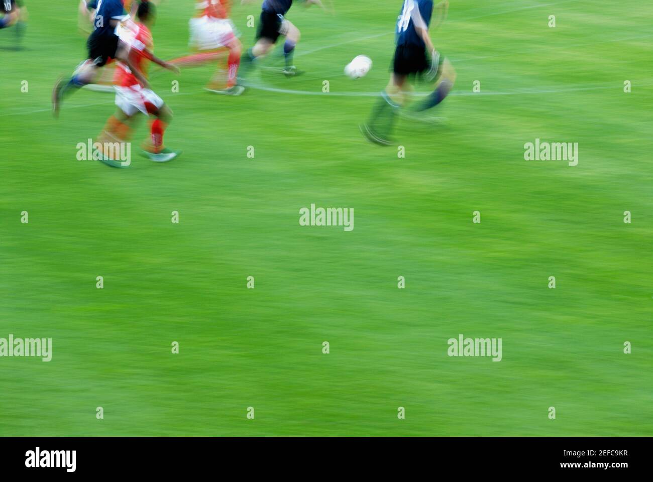 Soccer player playing soccer in a soccer field Stock Photo - Alamy
