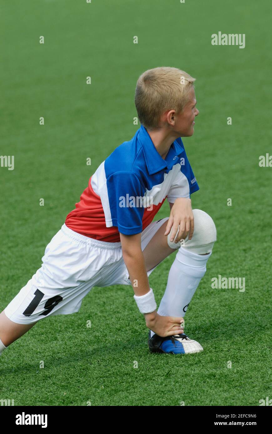 Soccer boy stretching hi-res stock photography and images - Alamy