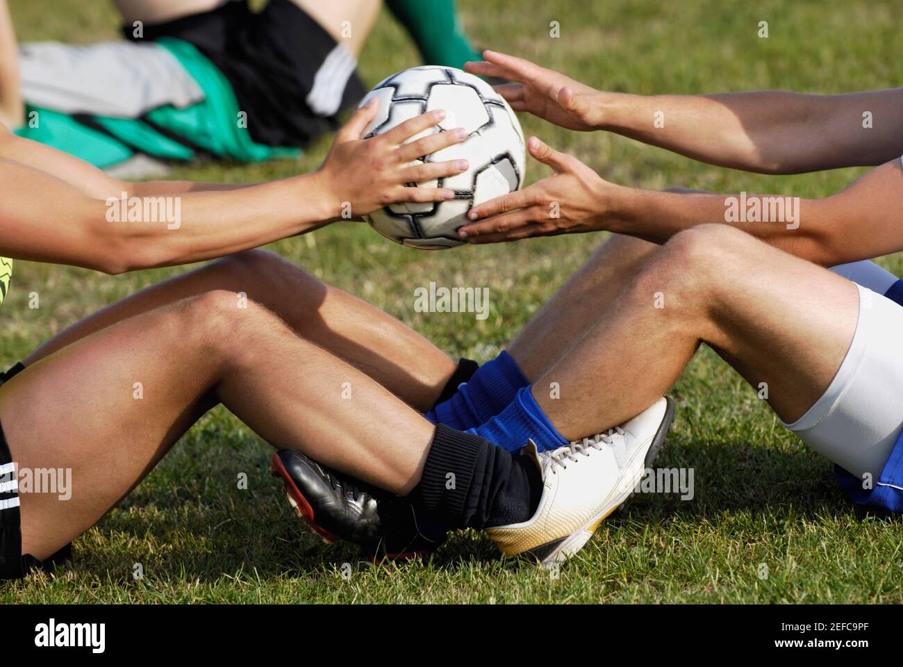 Side profile of two soccer players training with a soccer player Stock ...
