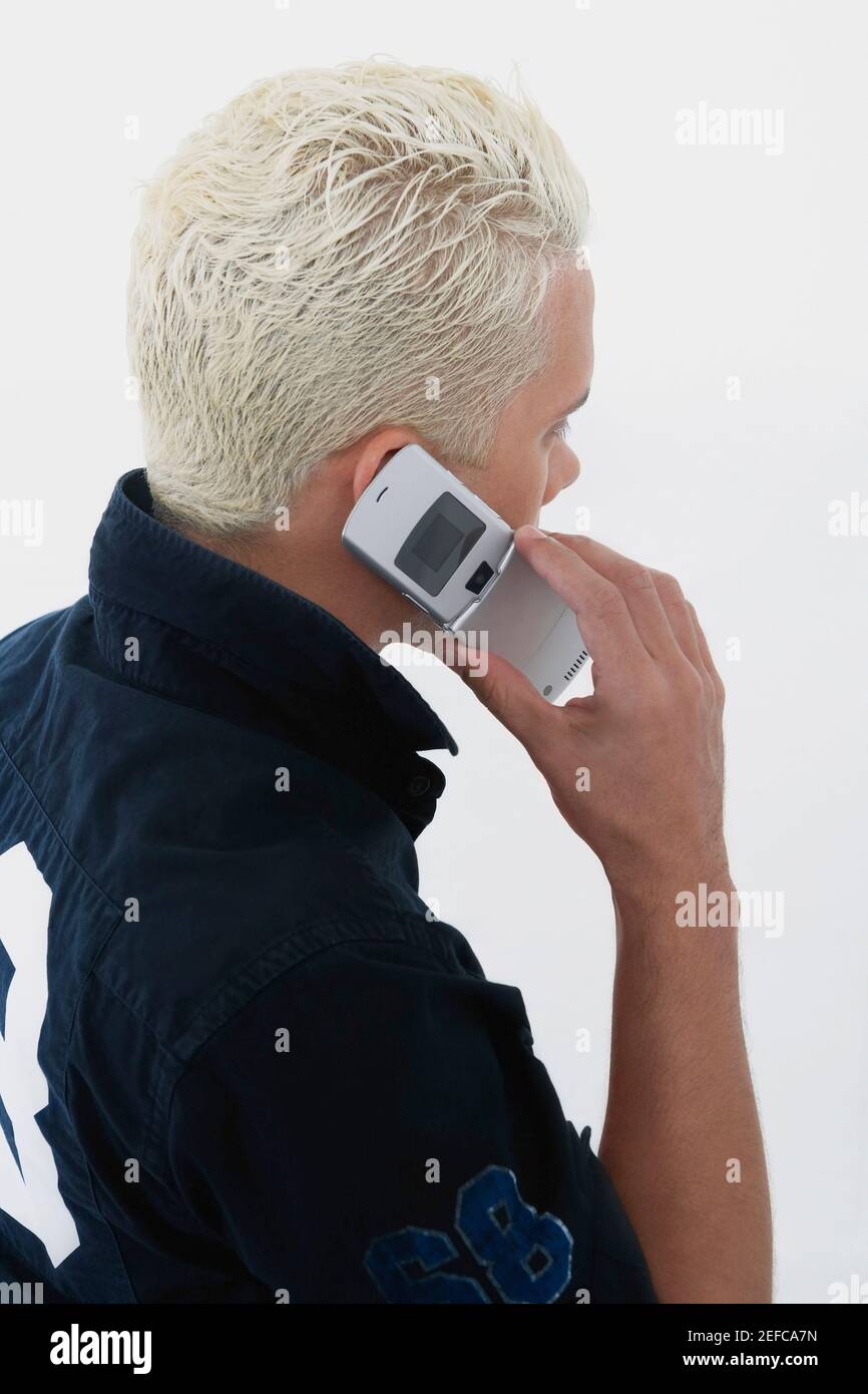 Side profile of a young man using a mobile phone Stock Photo - Alamy