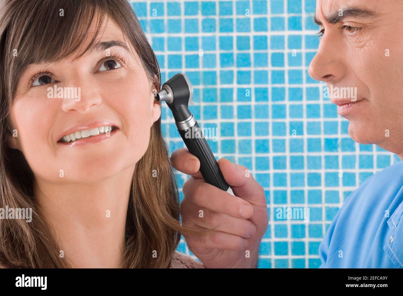 Ear inspection woman hi-res stock photography and images - Alamy