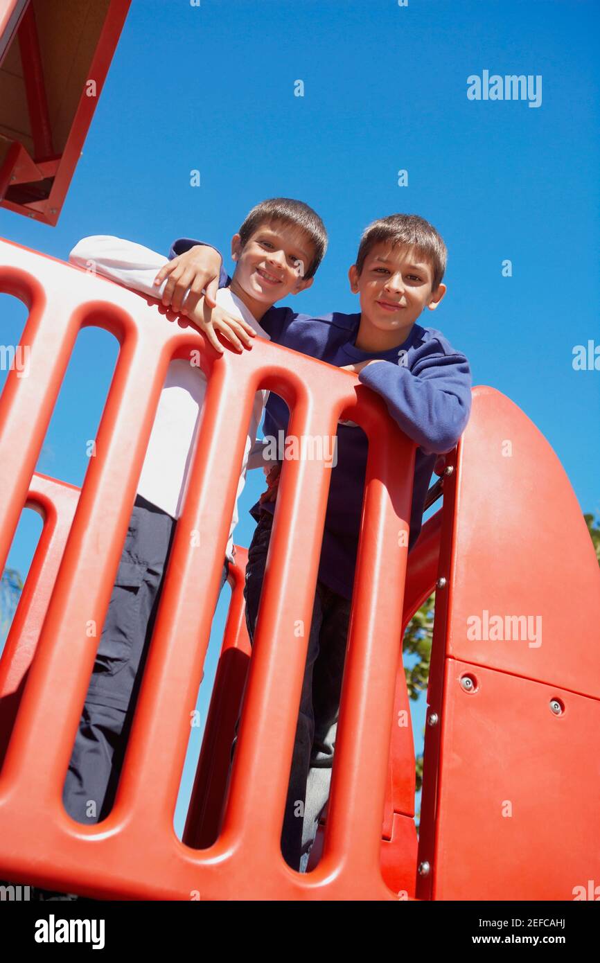 Portrait of two brothers smiling and standing together Stock Photo - Alamy