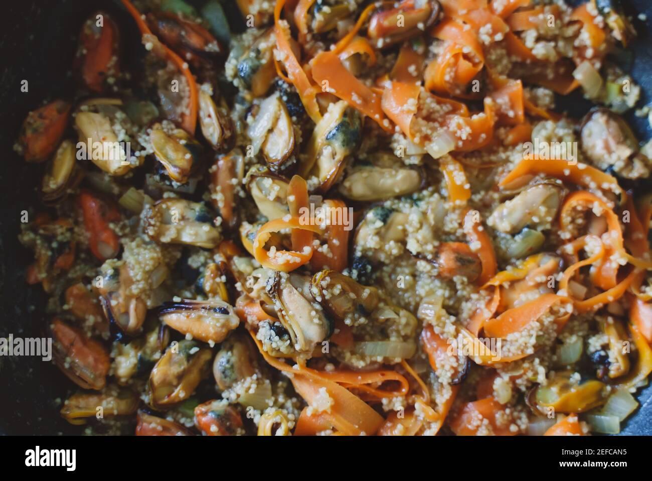 Cooking of traditional Moroccan couscous with mussels Stock Photo - Alamy