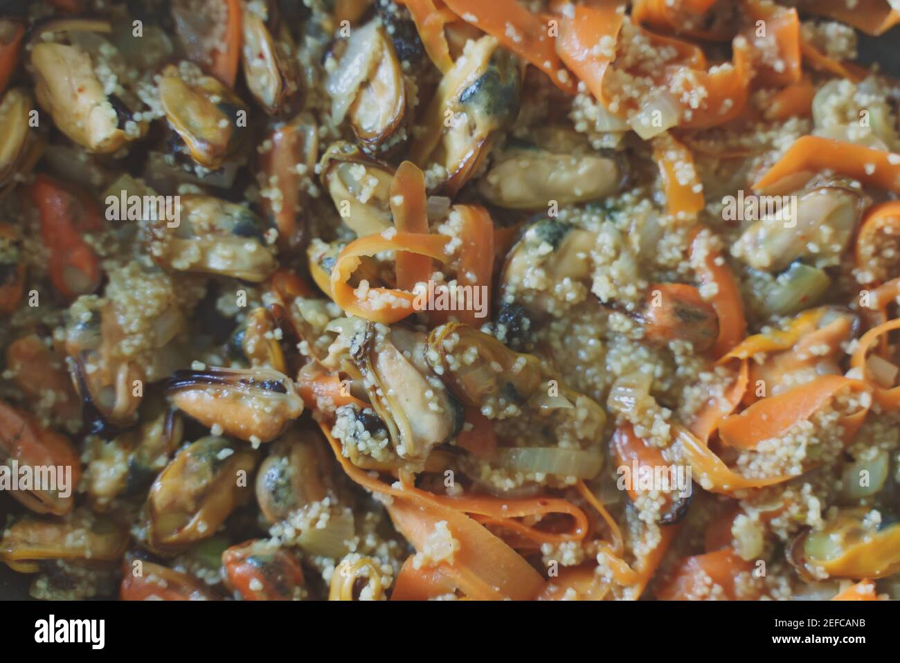 Cooking of traditional Moroccan couscous with mussels Stock Photo - Alamy