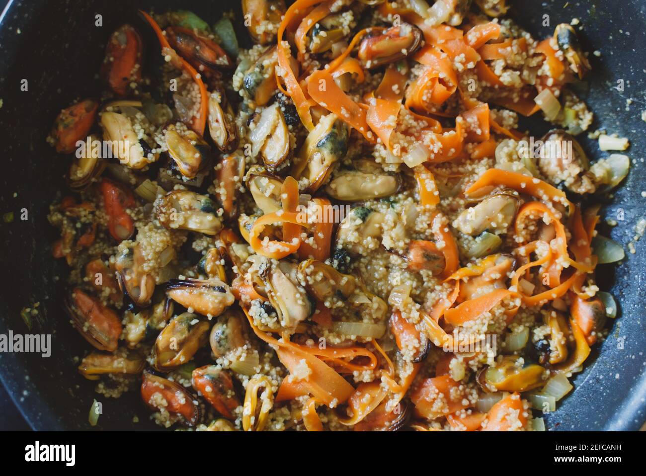 Cooking of traditional Moroccan couscous with mussels Stock Photo - Alamy
