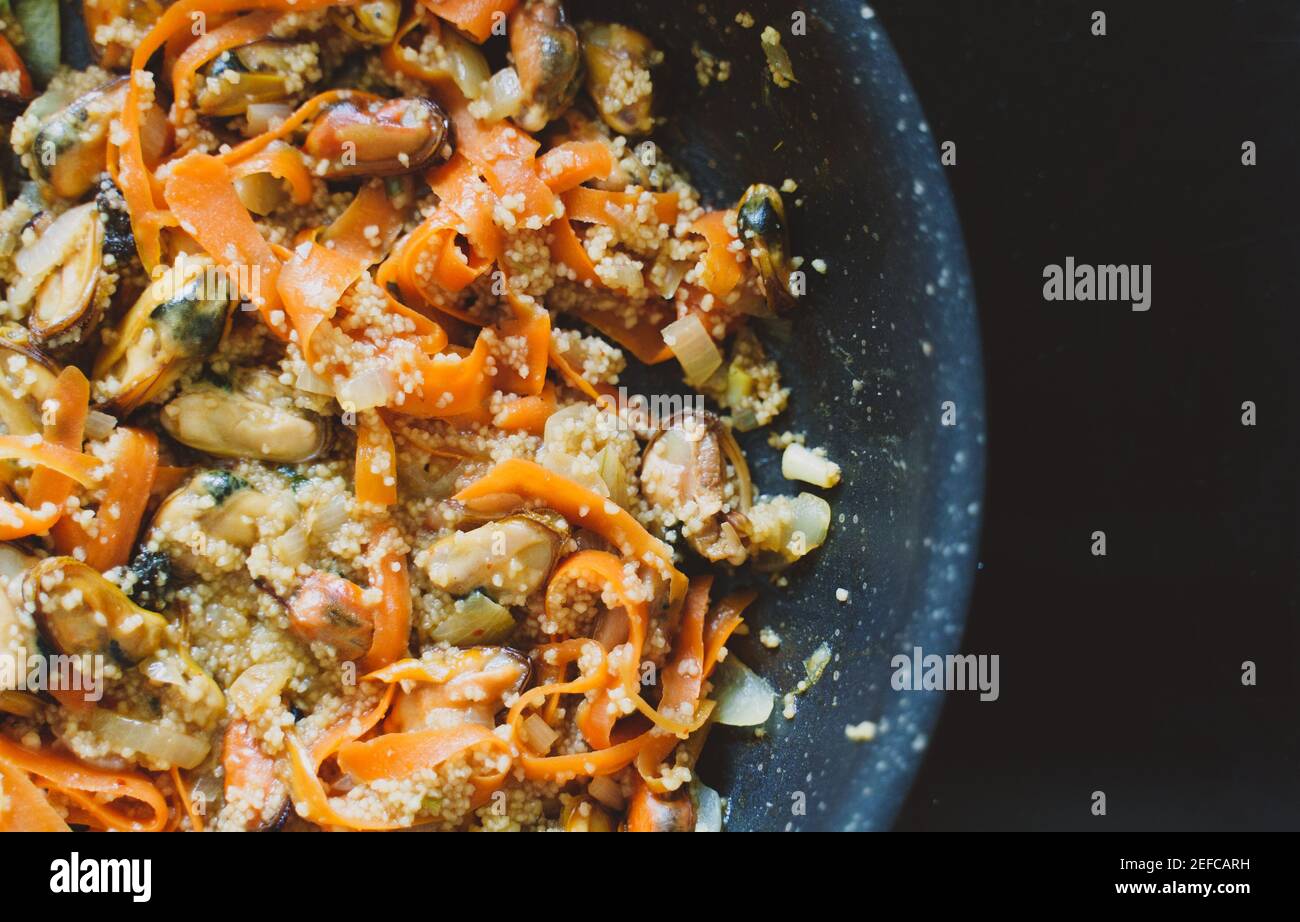 Cooking of traditional Moroccan couscous with mussels Stock Photo - Alamy