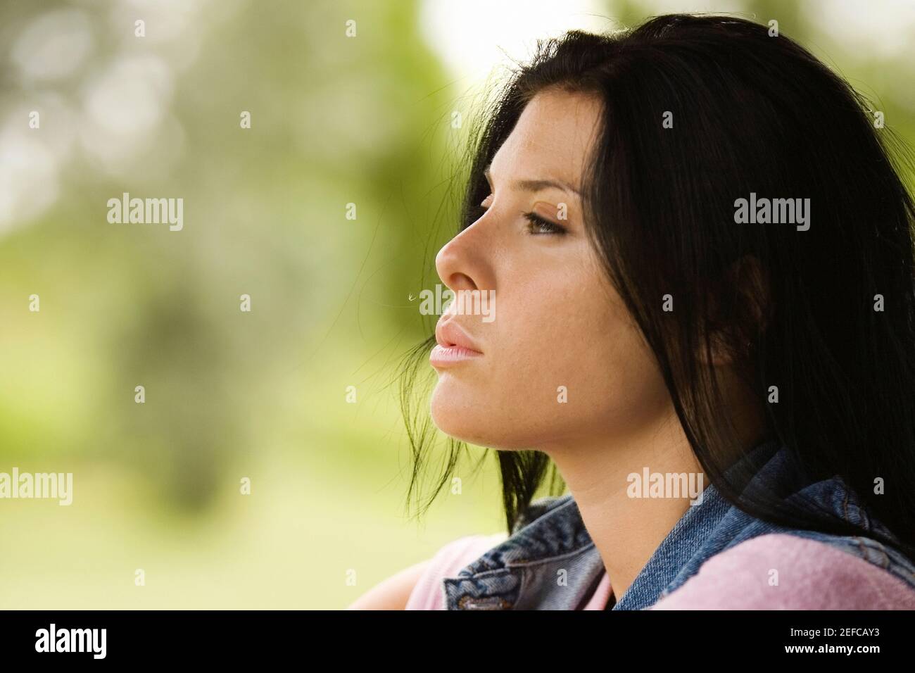 Latino woman side view serious hi-res stock photography and images - Alamy