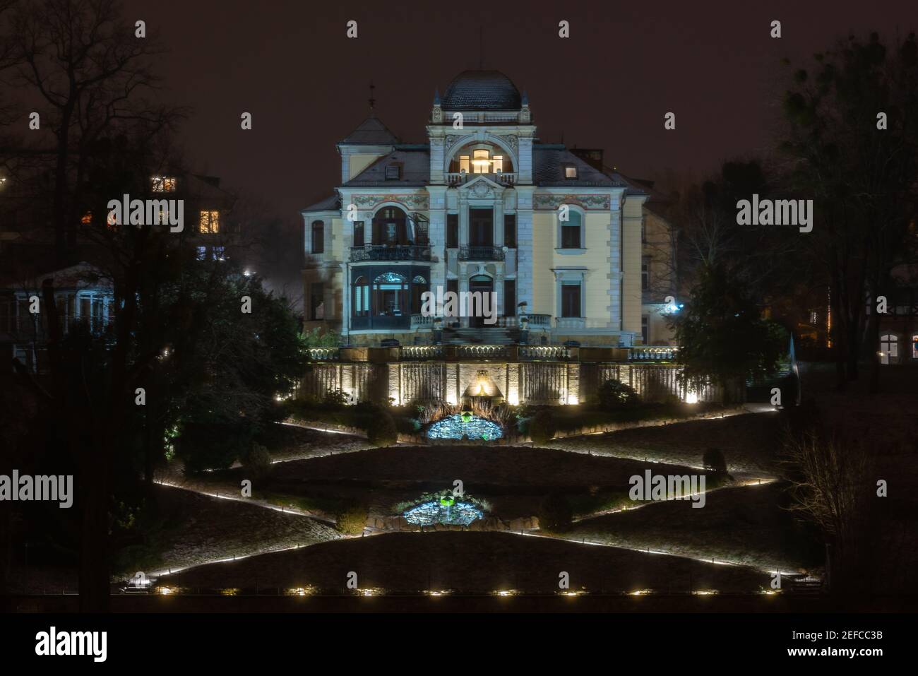 Mansion with lights on captured at night Stock Photo - Alamy