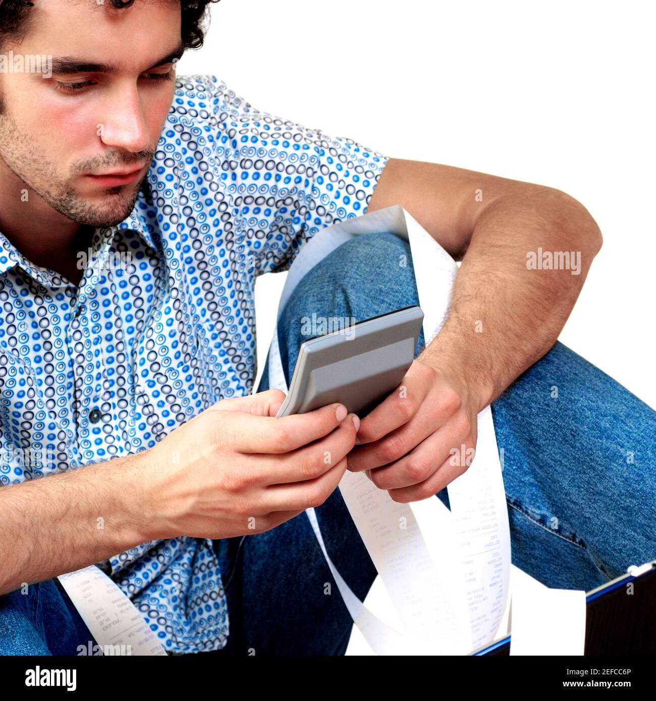 Young man using laptop calculator hi-res stock photography and images ...