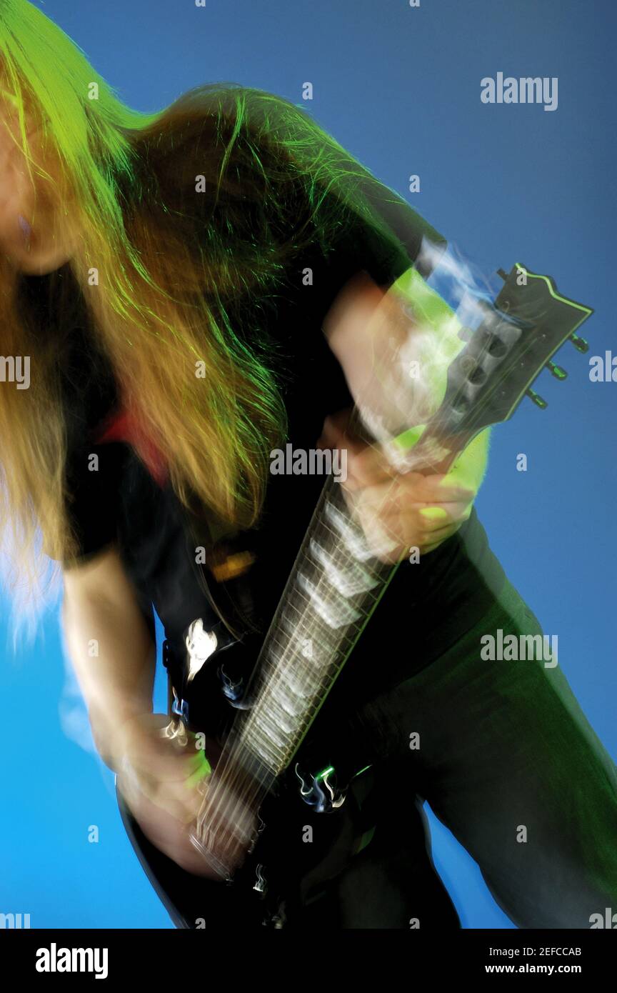 Mid section view of a musician playing the electric guitar Stock Photo ...