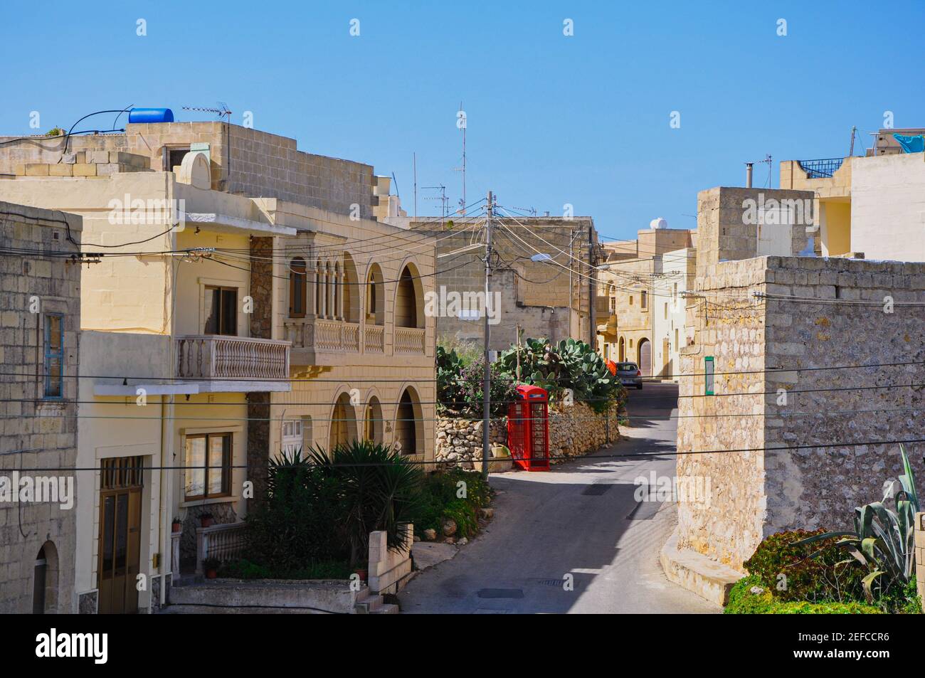 Empty old village under a clear blue sky background Stock Photo - Alamy