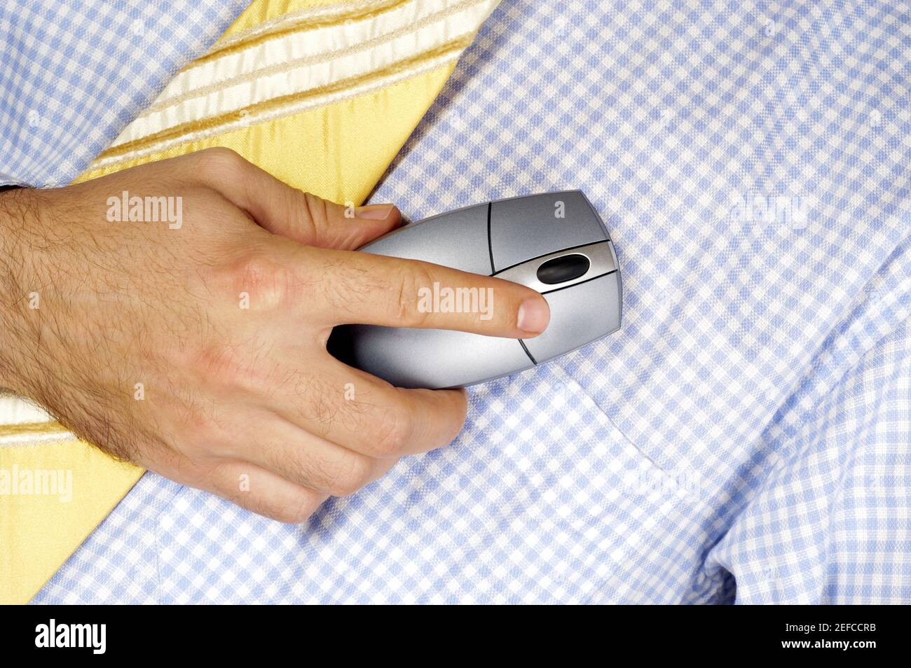 Mid section view of a businessman holding a computer mouse Stock Photo ...