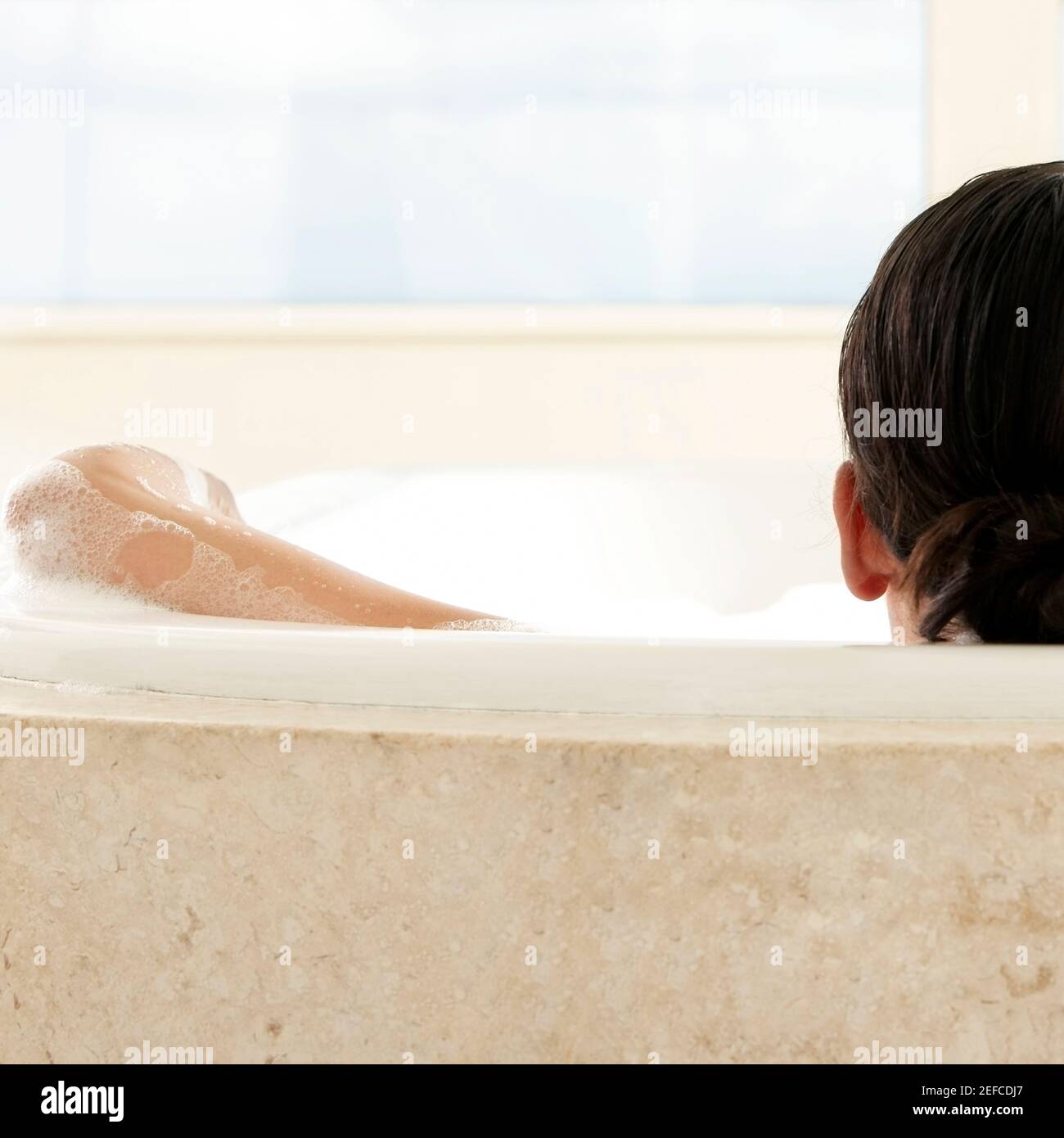 Rear view of a woman in the bathtub Stock Photo - Alamy