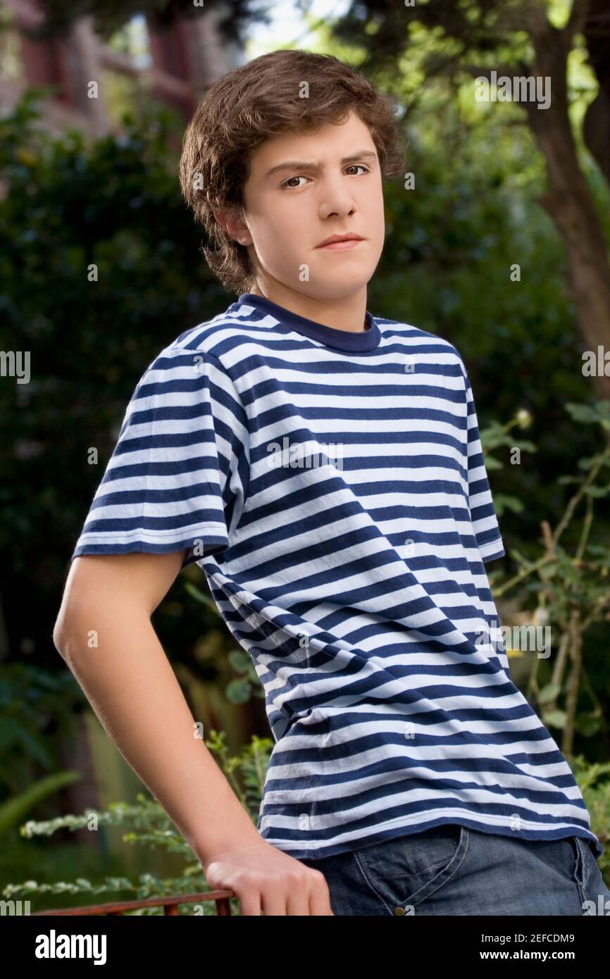 Portrait of a teenage boy looking serious Stock Photo - Alamy