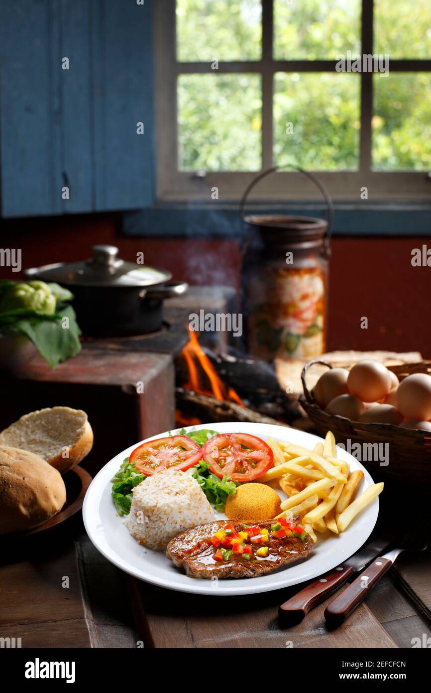 Rice with potatoes and meat Stock Photo - Alamy