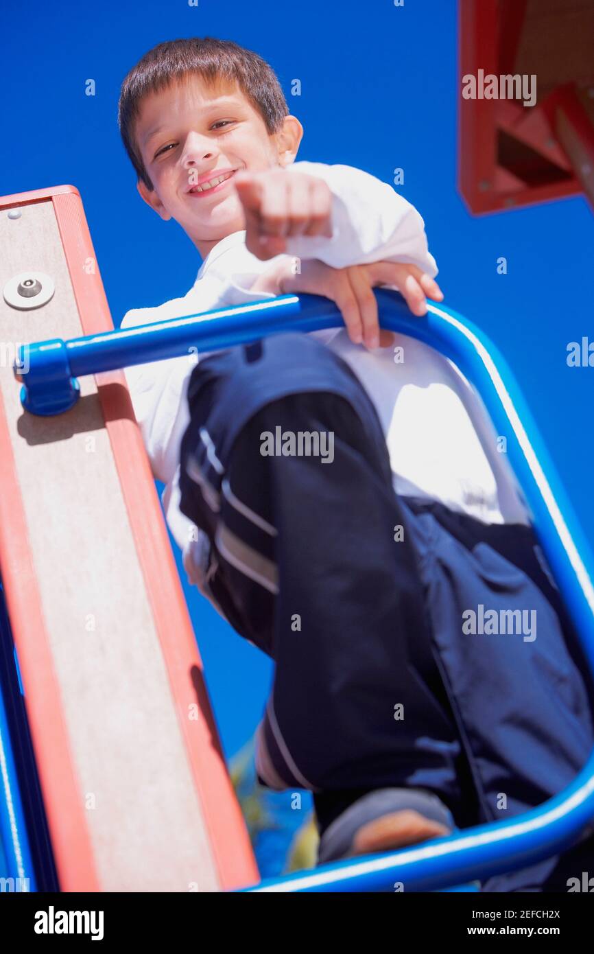 Low angle view of a boy standing and pointing Stock Photo - Alamy