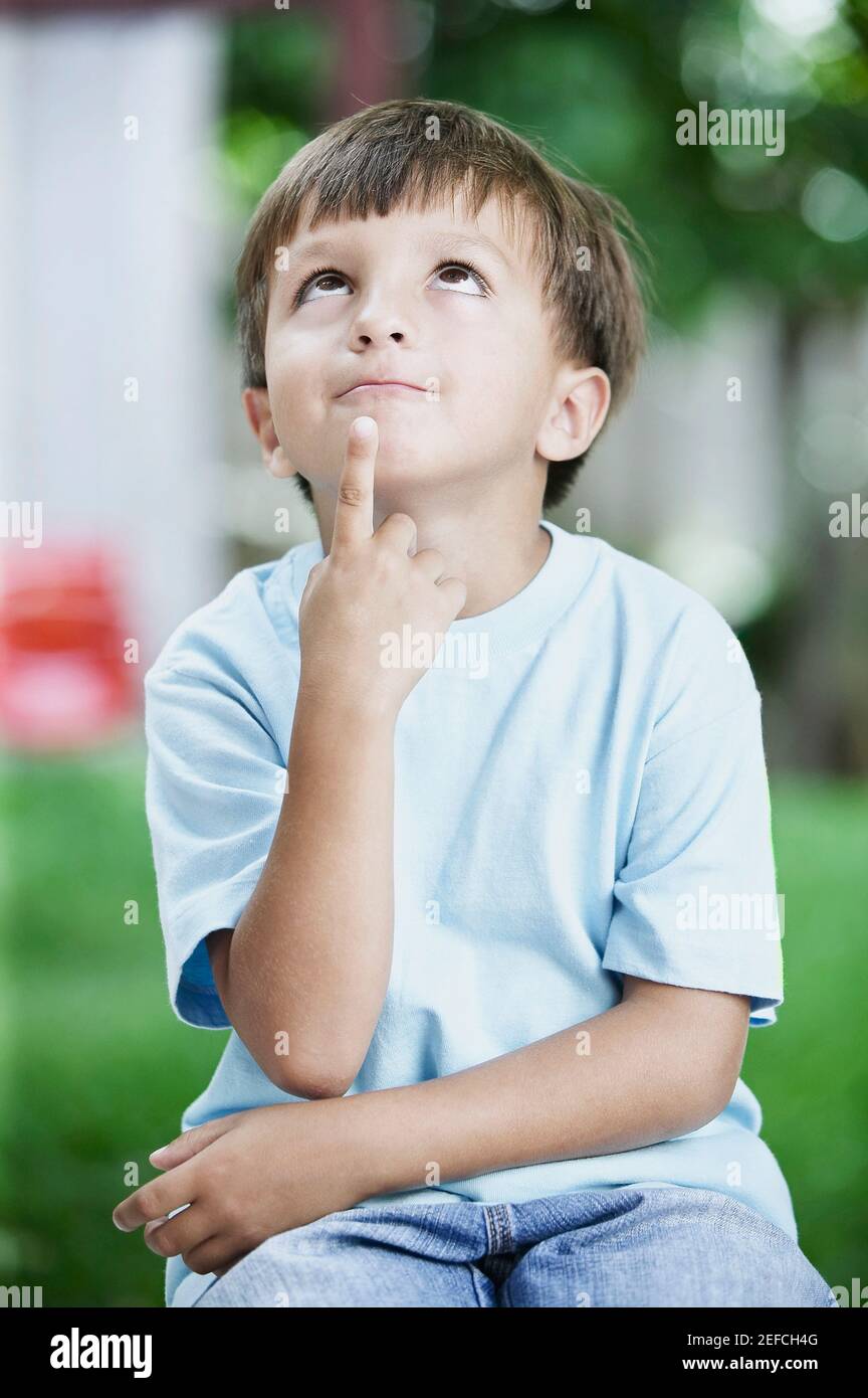 Latino boy thinking hi-res stock photography and images - Alamy