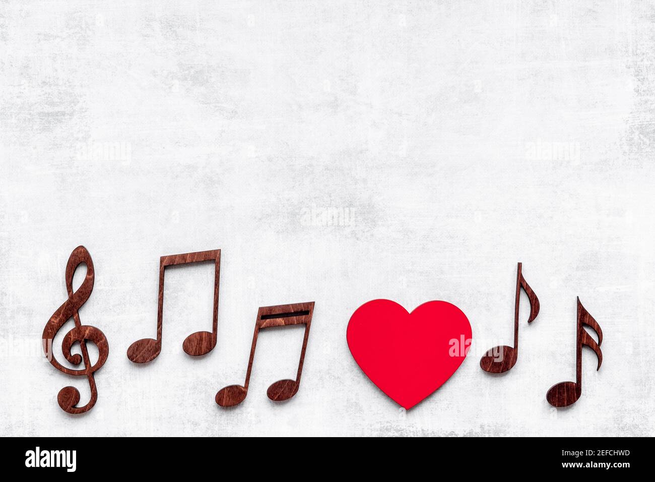 Love songs - musical wooden notes with heart, top view Stock Photo - Alamy
