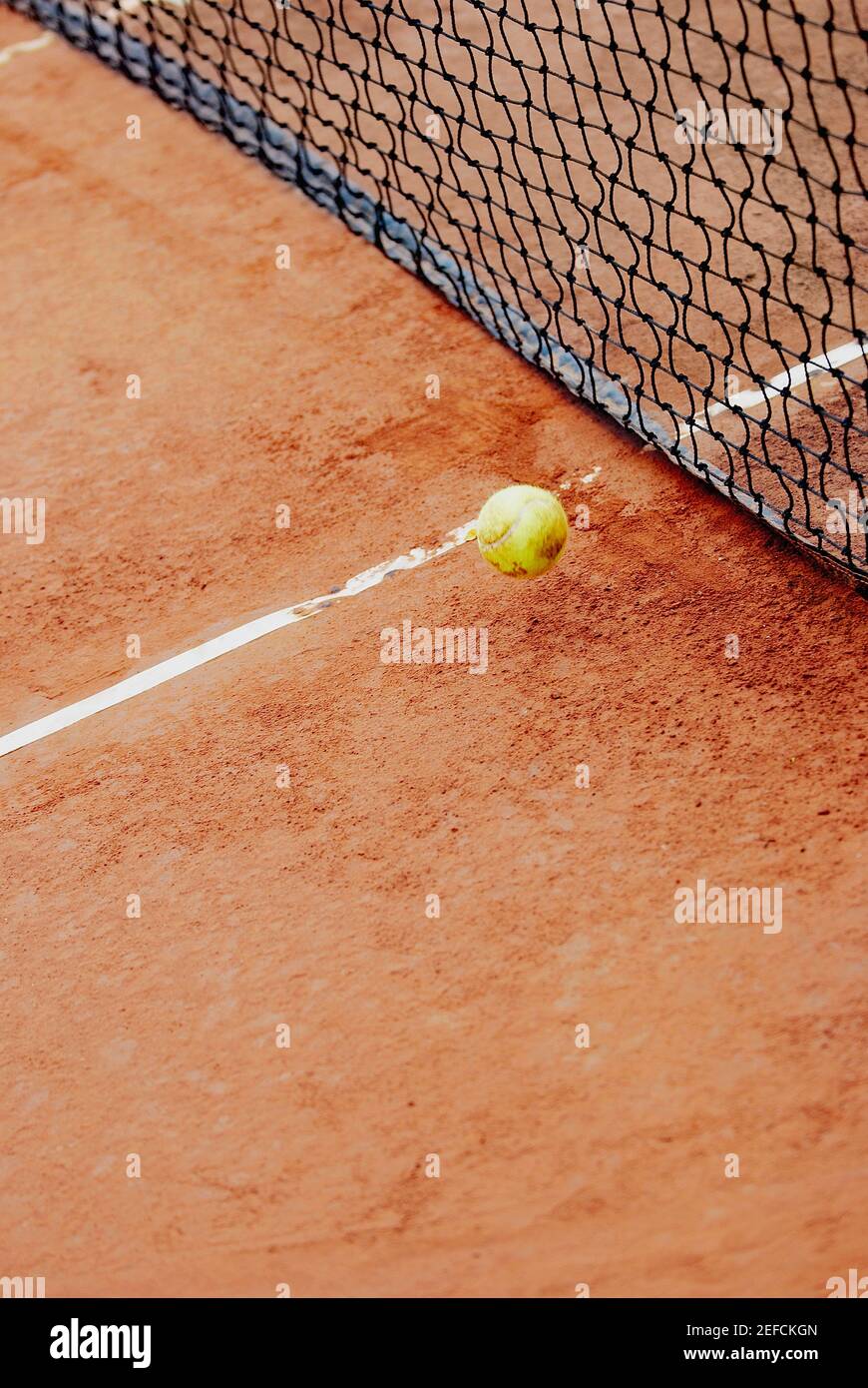 High angle view of a tennis ball near a tennis net Stock Photo - Alamy
