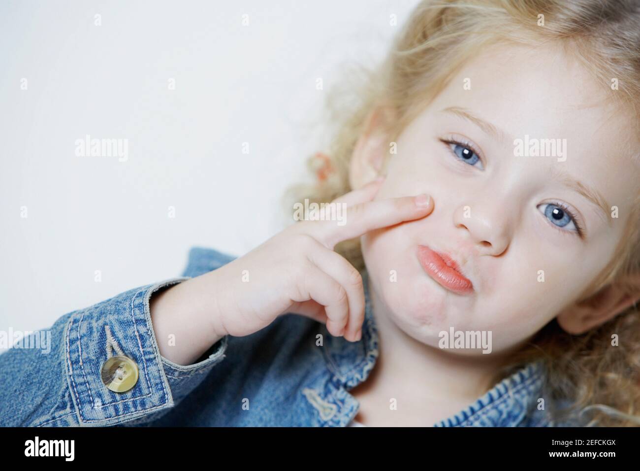 Portrait of a girl making a face Stock Photo - Alamy