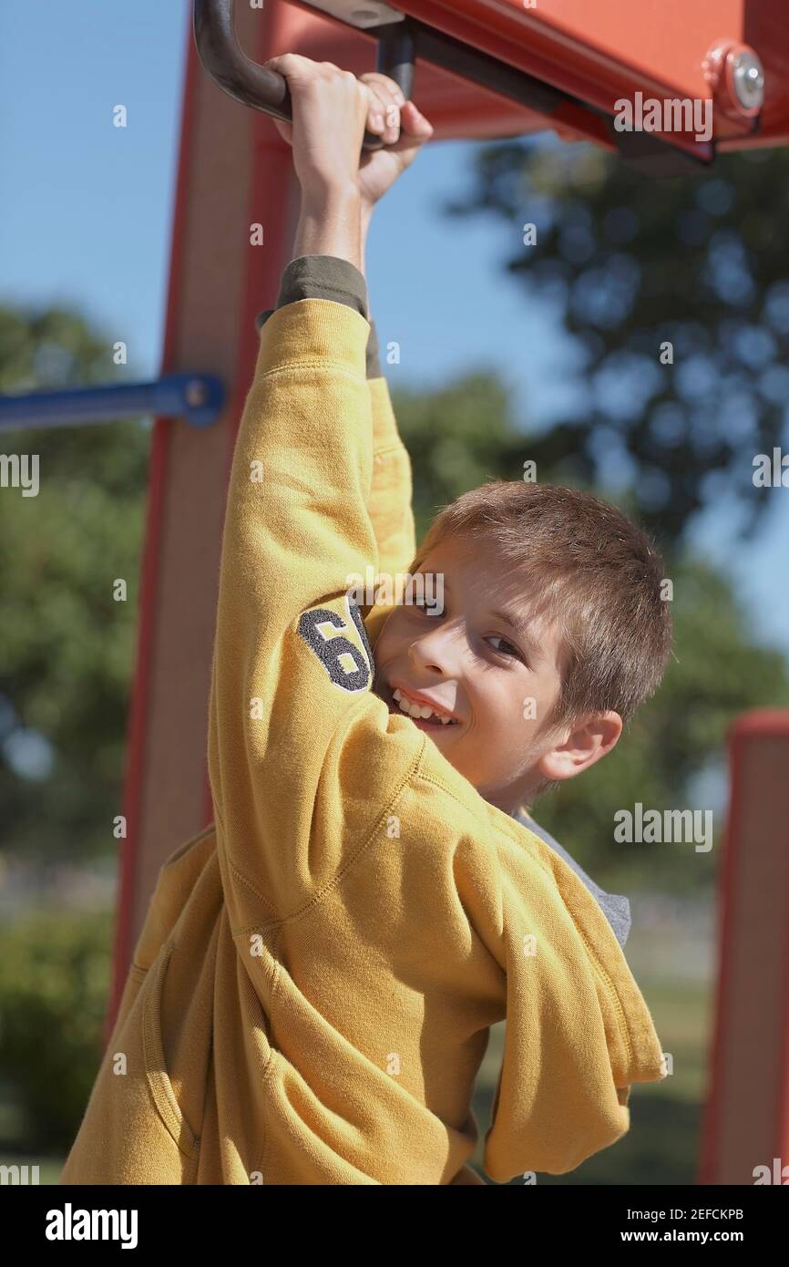 Hanging on jungle gym hi-res stock photography and images - Alamy