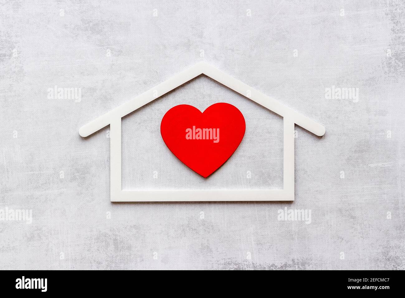 House shape with heart. Love family concept Stock Photo - Alamy