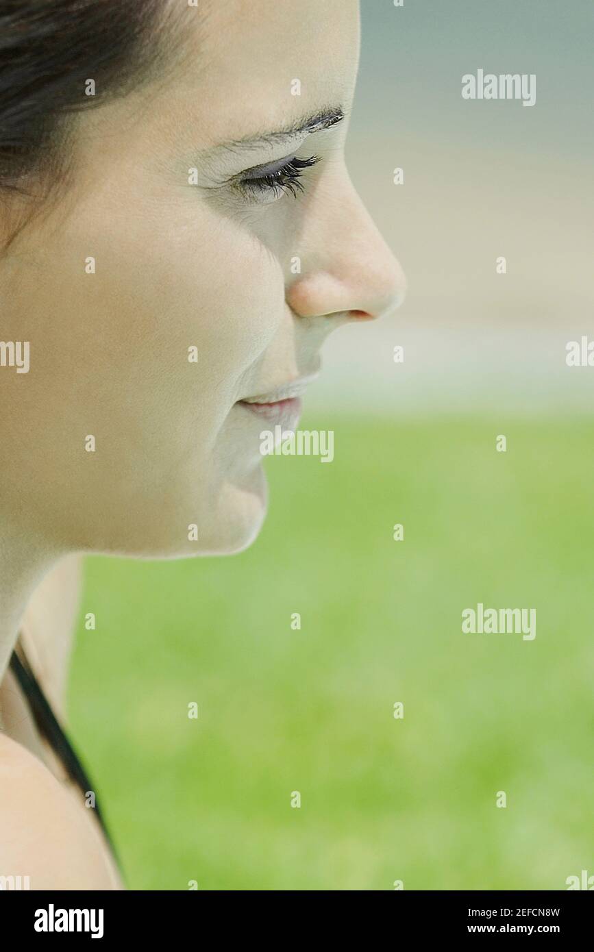 Side profile of a young woman Stock Photo - Alamy