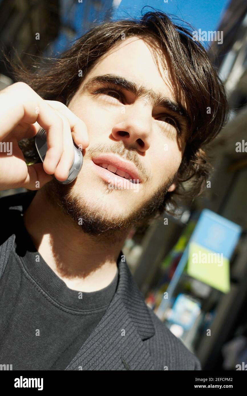 Young colleagues using mobile hi-res stock photography and images - Alamy