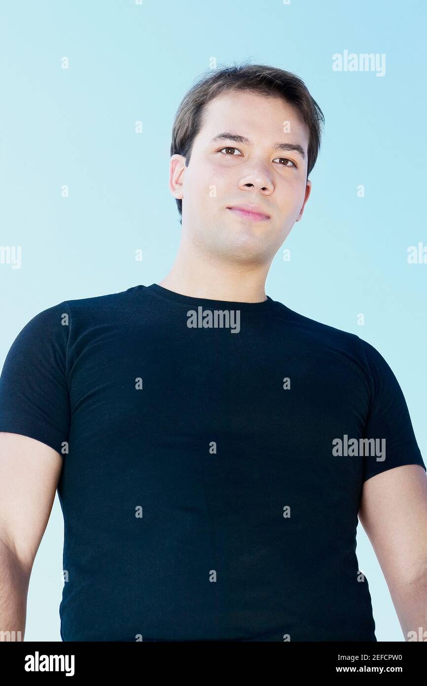 Portrait of a young man standing Stock Photo - Alamy
