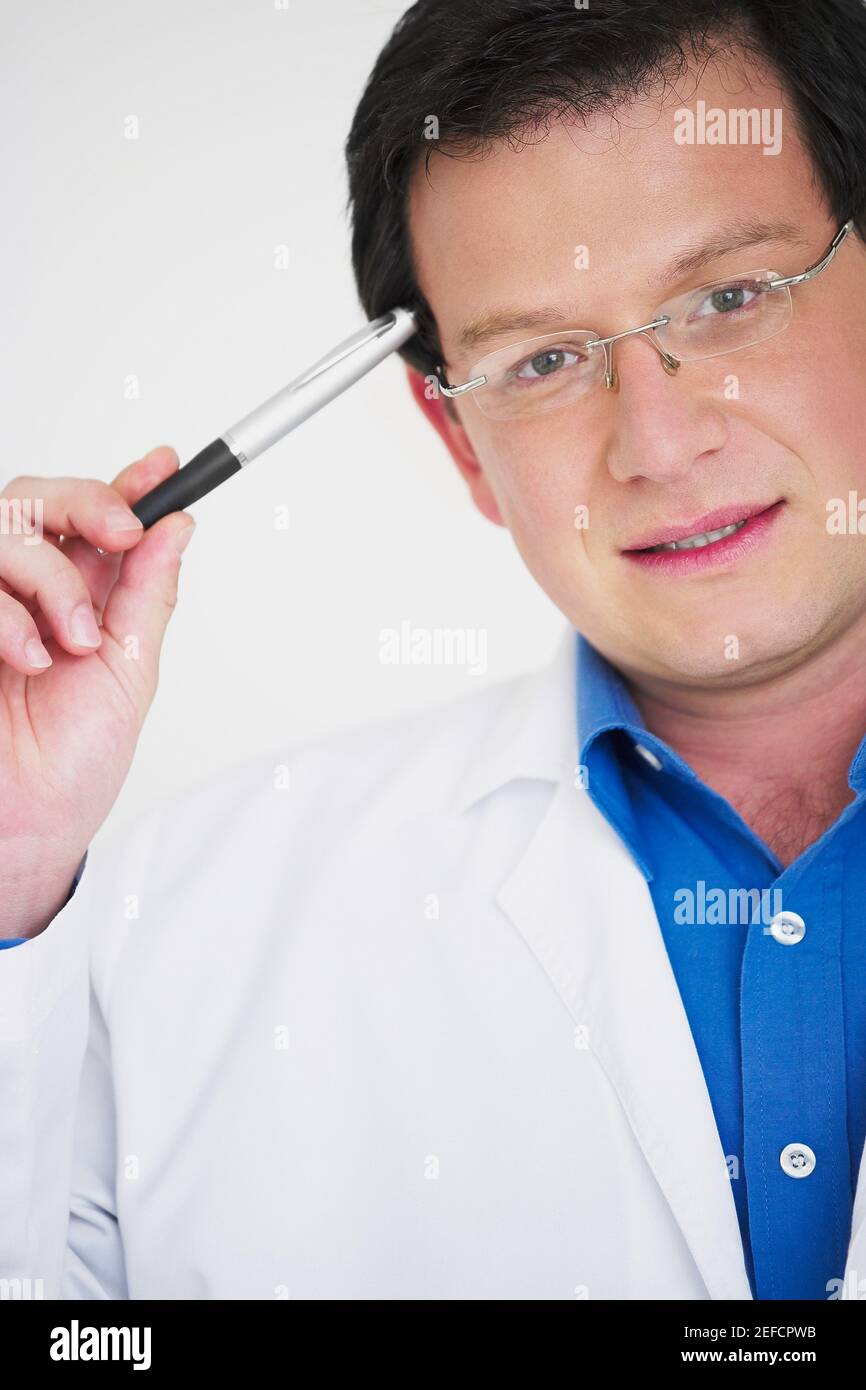 Portrait of a male doctor thinking Stock Photo - Alamy