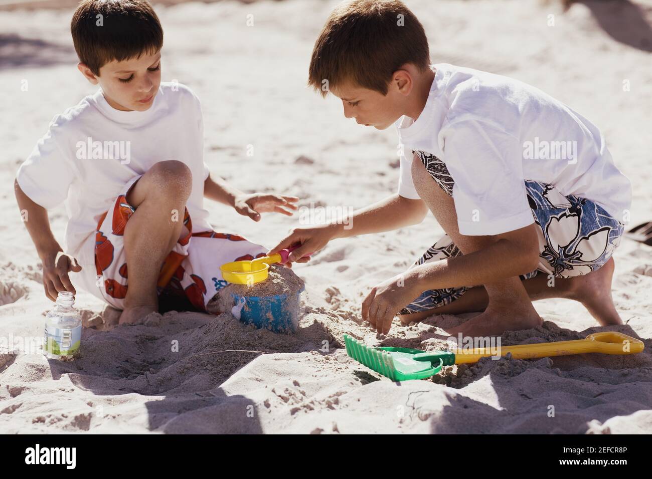 Boy playing sand pail shovel hi-res stock photography and images - Alamy