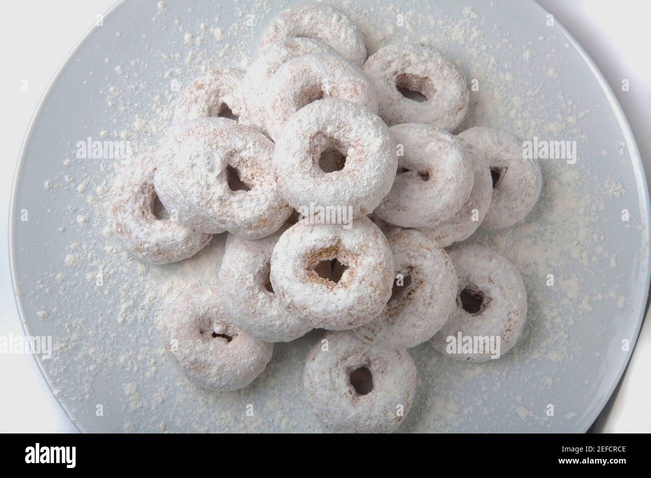 Close up of powdered doughnuts in a plate Stock Photo - Alamy