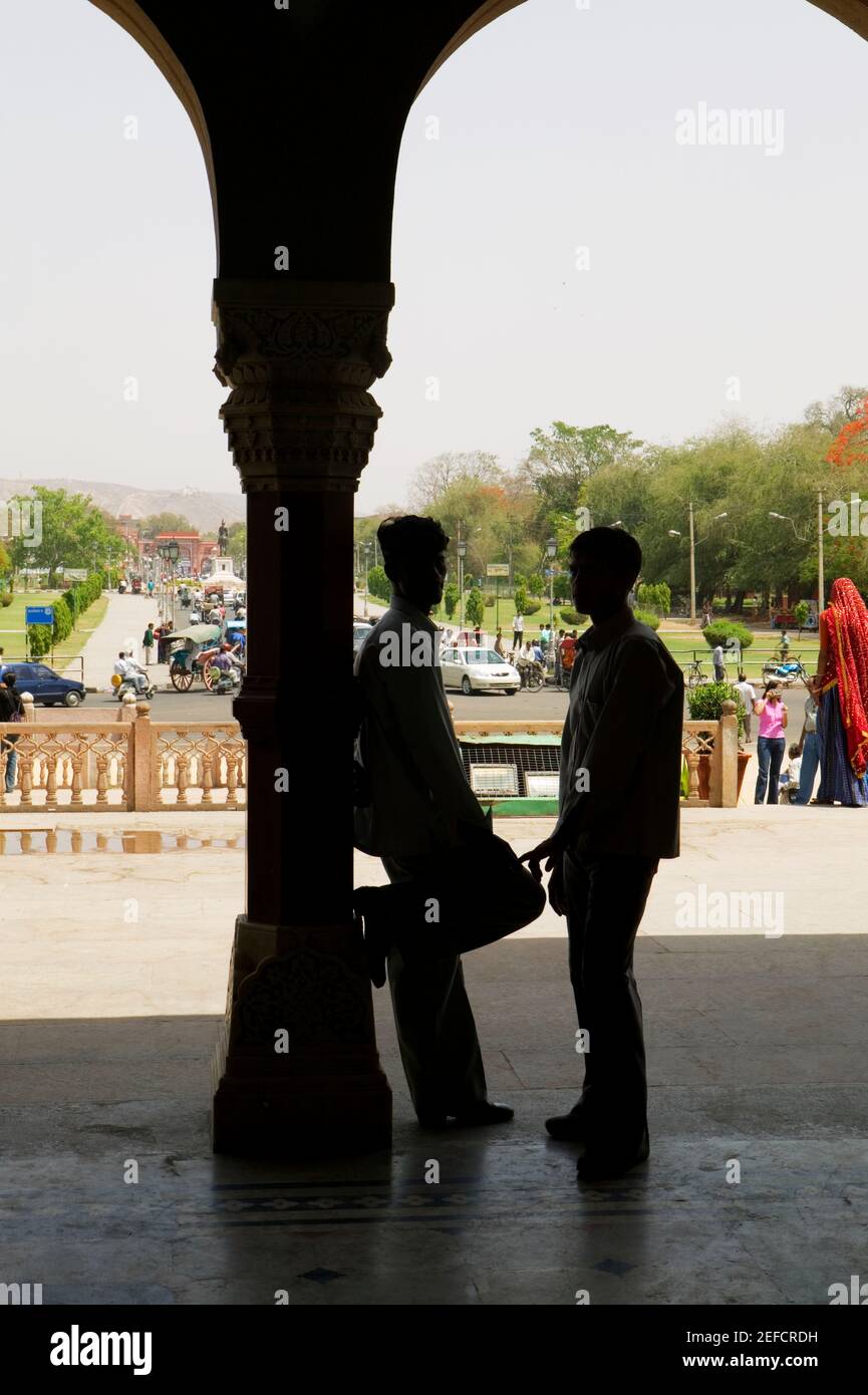 Side profile of two men standing face to face hi-res stock photography ...