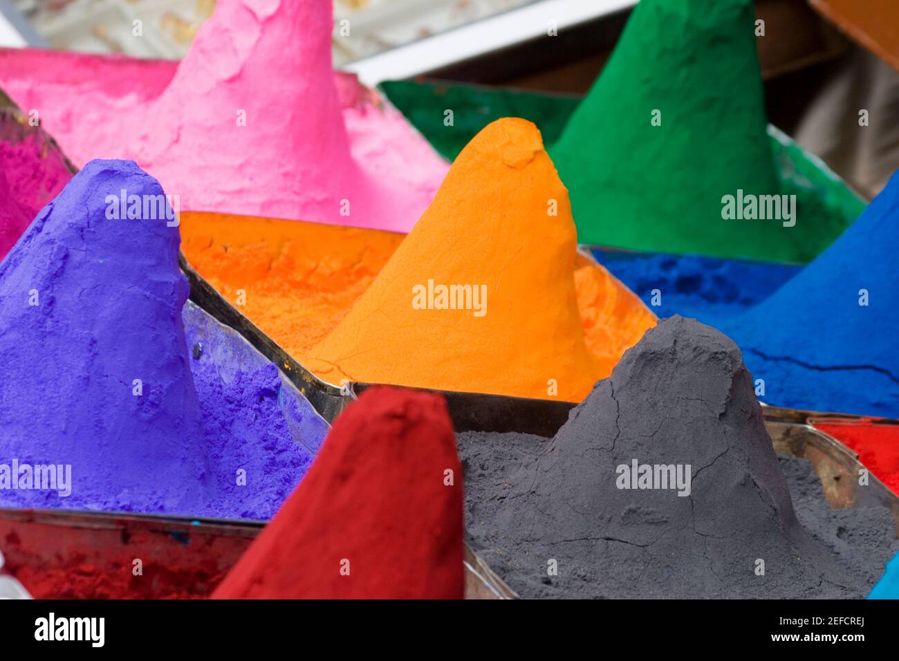 Close-up of mounds of colored powder used for Hindu rituals, Pushkar ...