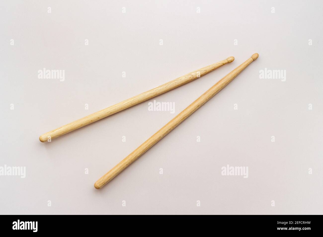 Two wooden drum sticks, top view. Music background Stock Photo - Alamy