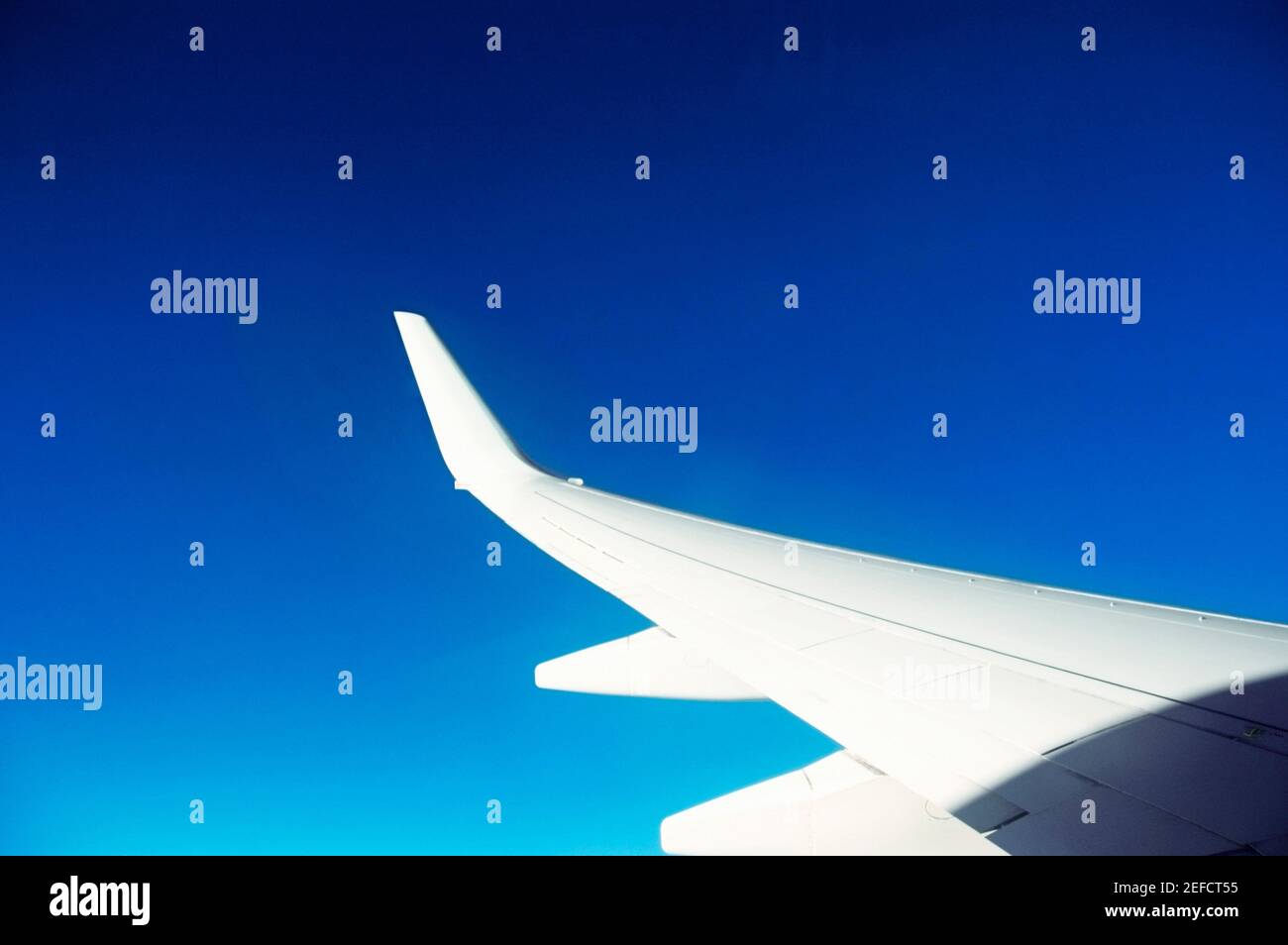 Close-up of an airplane wing in flight Stock Photo - Alamy