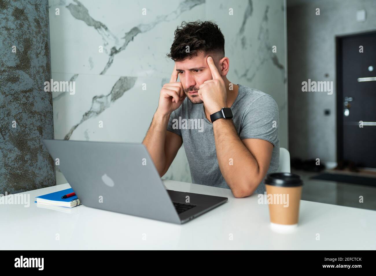 Frustrated sad young man looking at laptop screen, feeling nervous ...