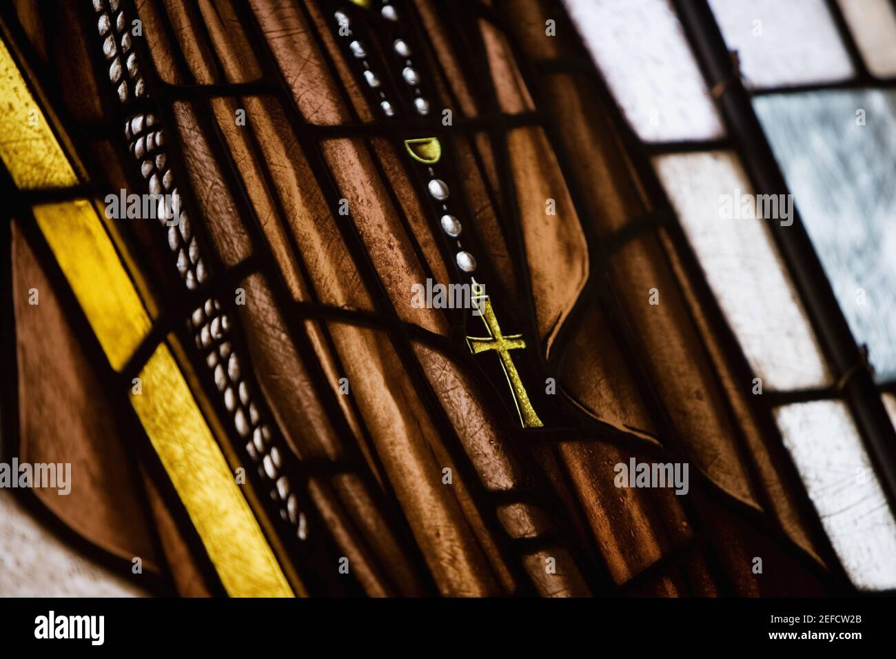 Close-up of a cross on a stained glass window Stock Photo - Alamy