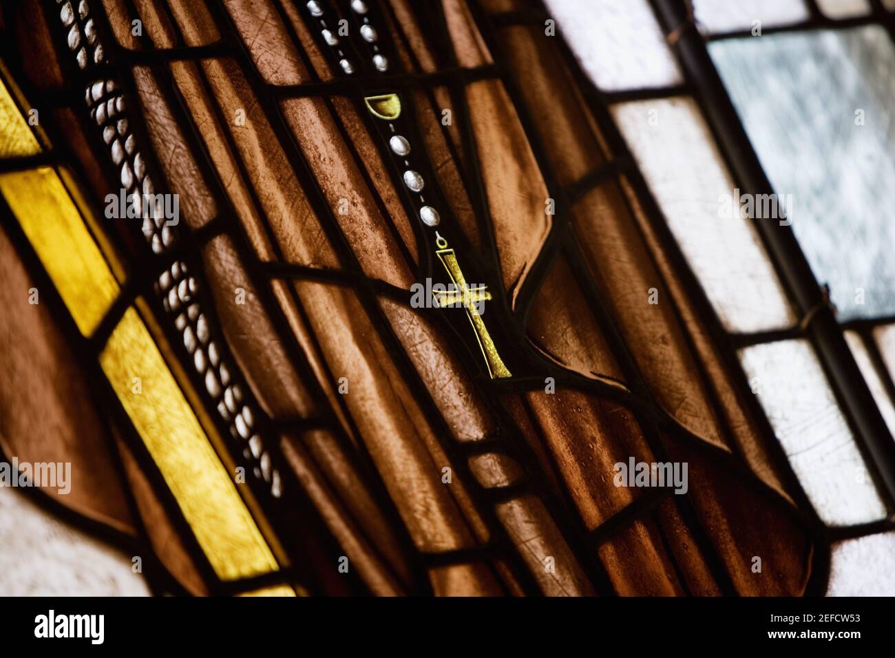 Close-up of a cross on a stained glass window Stock Photo - Alamy