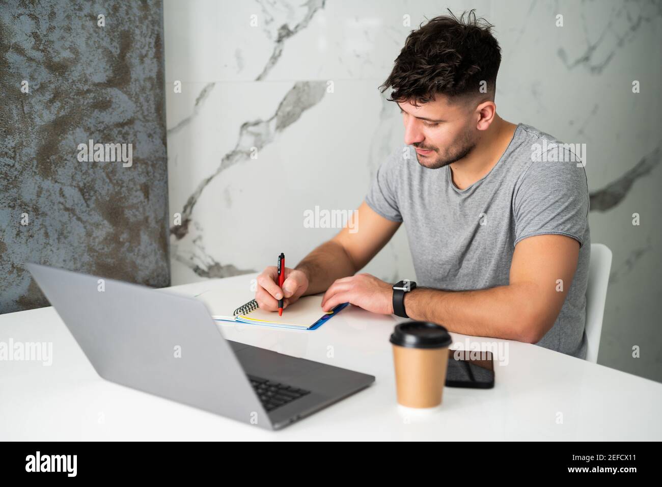 Man making financial revision. Home budget concept Stock Photo - Alamy