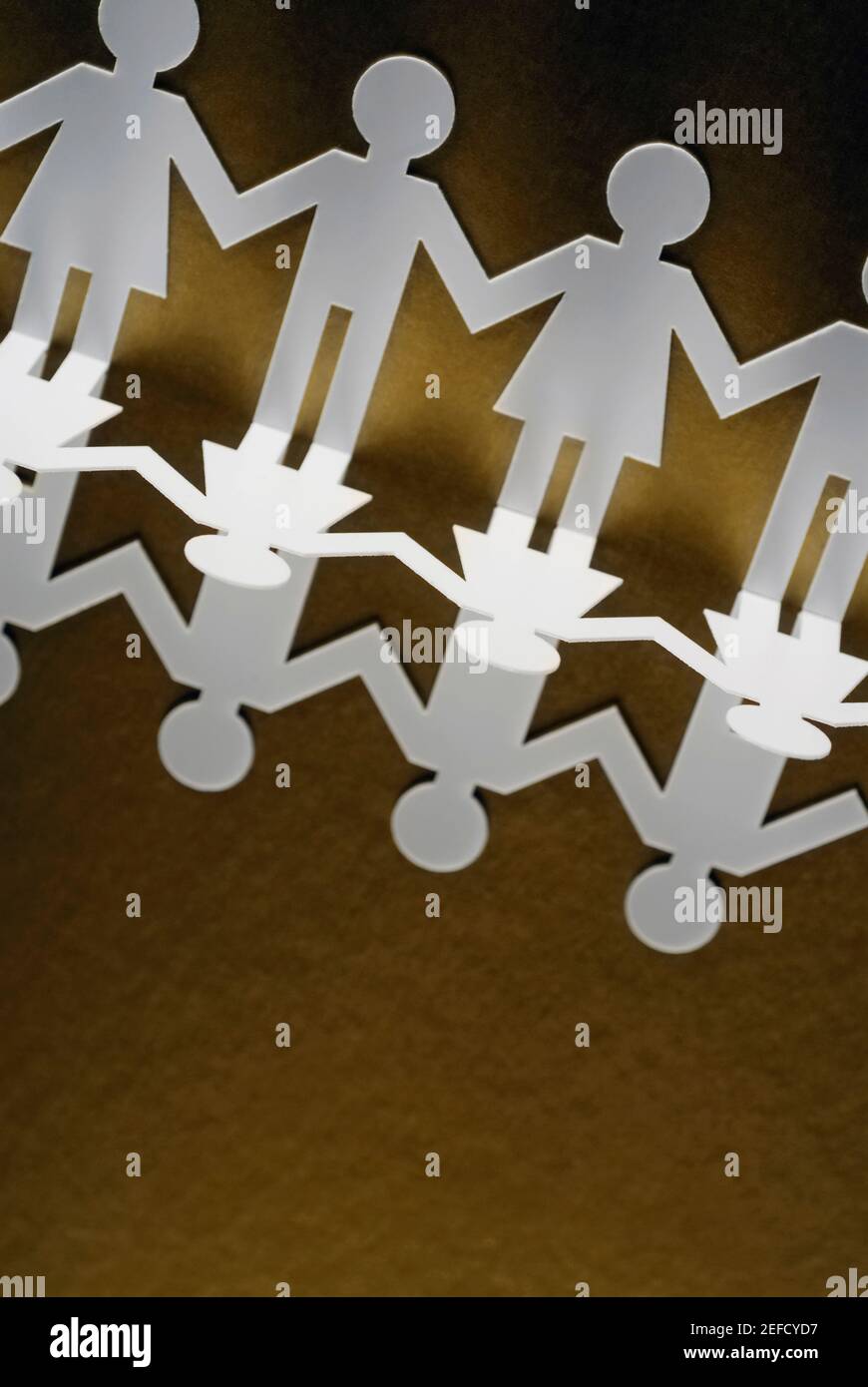 High angle view of paper chain dolls Stock Photo - Alamy