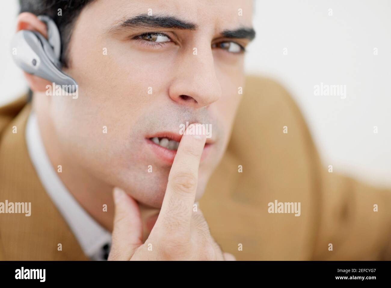 Thinking woman finger on lips hi-res stock photography and images - Alamy