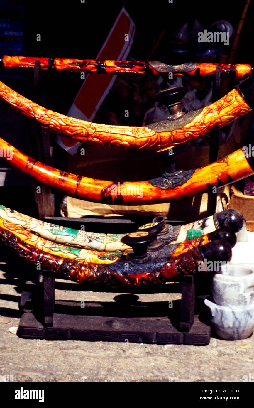 Close-up of carved elephant tusks on display Stock Photo - Alamy