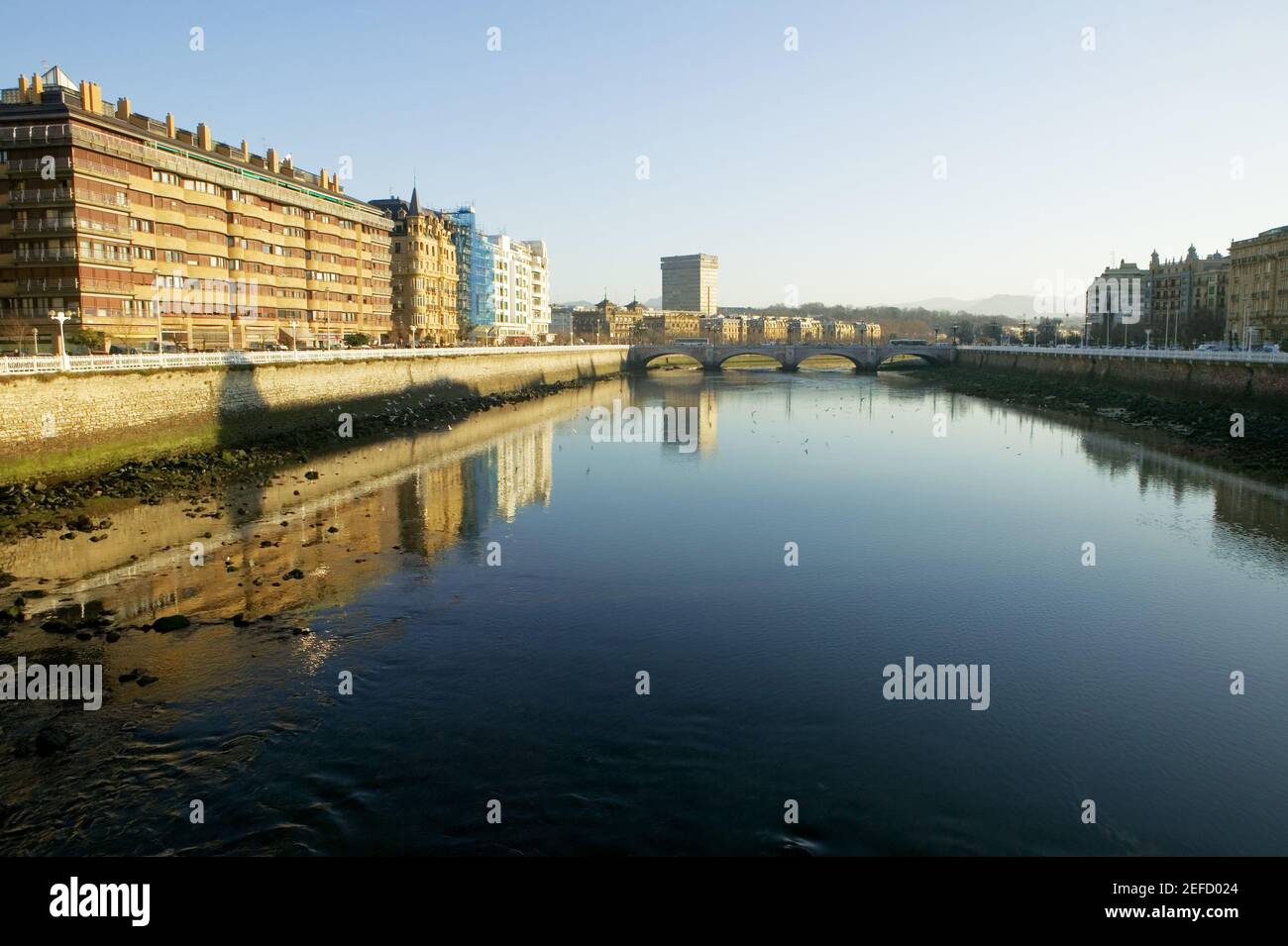 Buildings on the both sides of a river, Spain Stock Photo - Alamy