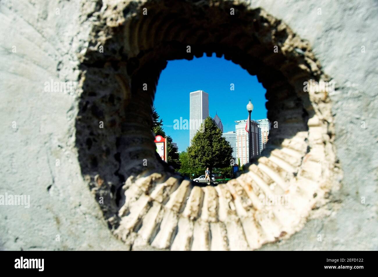 Skyscrapers viewed through a hole in a wall, Gateway Park, Chicago ...