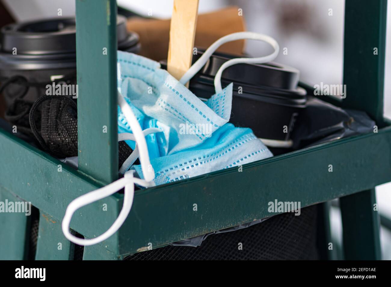 Used surgical or medical protective face masks abandoned or discarded ...