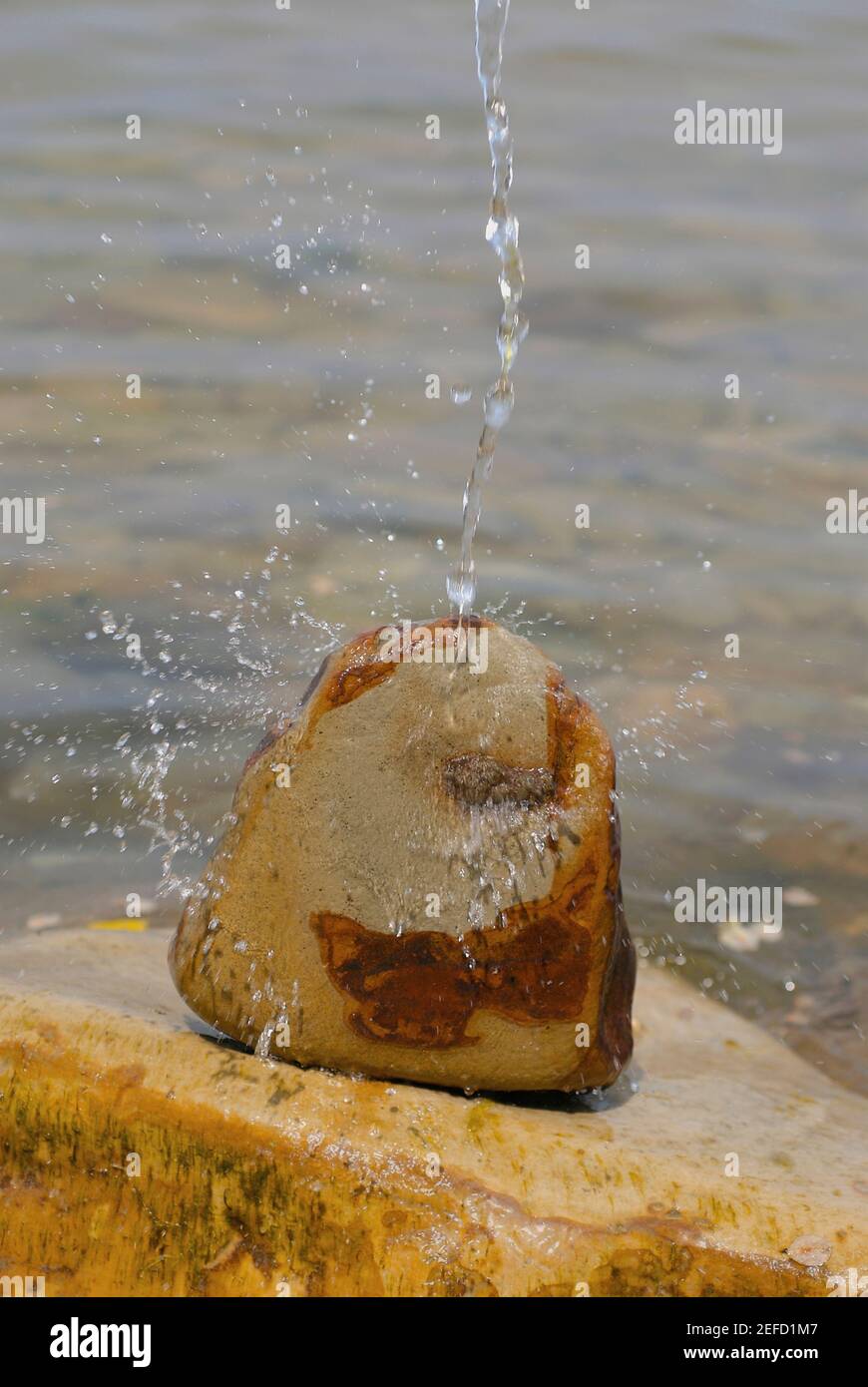 Water falling on rocks Stock Photo - Alamy