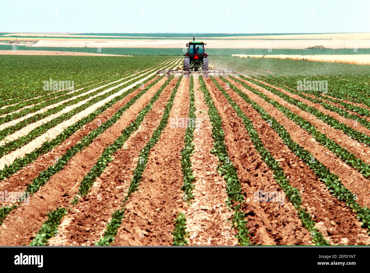 Combine Plowing soy bean field, Colorado Stock Photo - Alamy