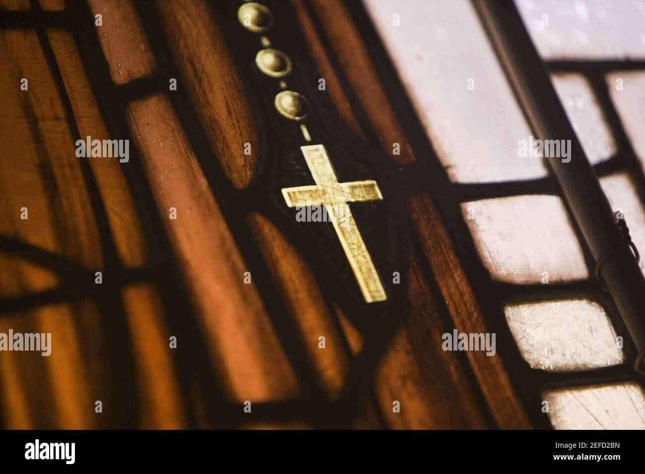 Close-up of a cross on a stained glass window Stock Photo - Alamy